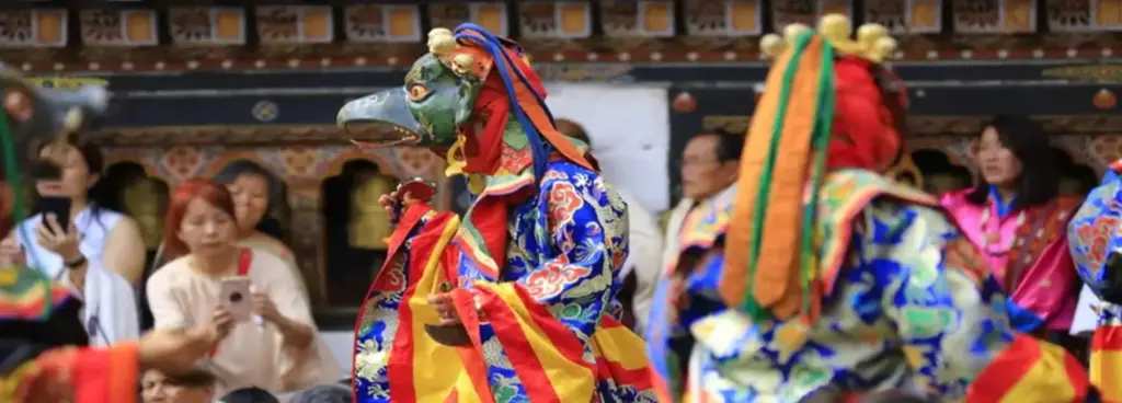 Sacred mask dancers at Jambay Lhakhang Drup festival, Bumthang Bhutan